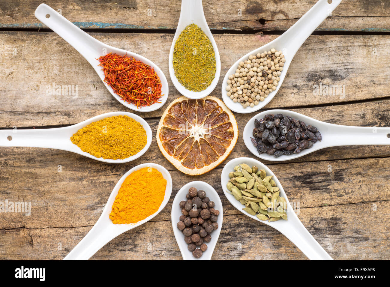Spices background. Diversity of condiments on wooden table. Top View ...