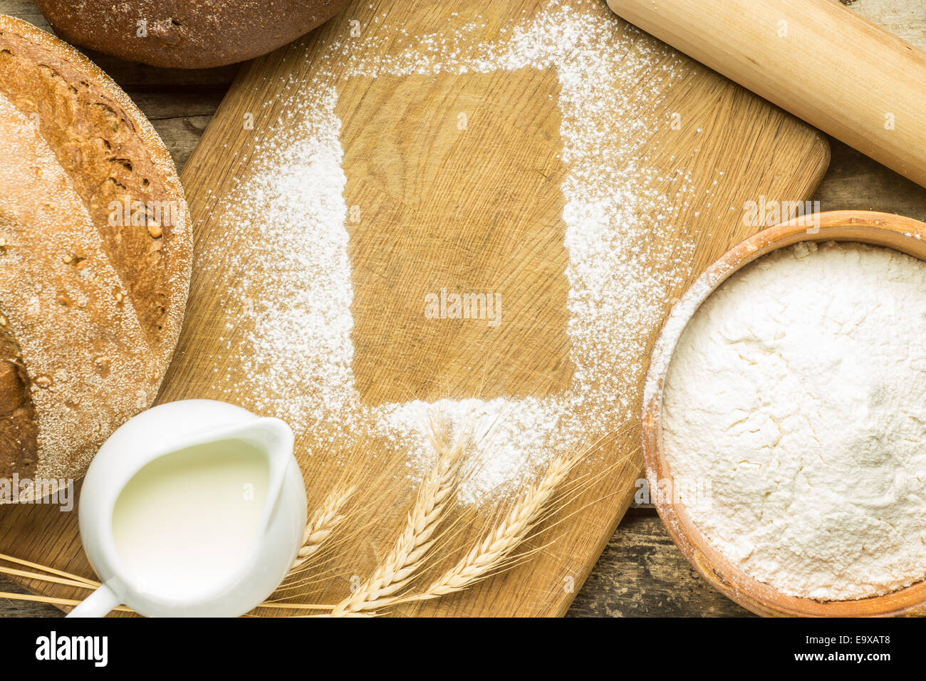 Bakery ingredients with flour frame on board. Recipe and menu ...