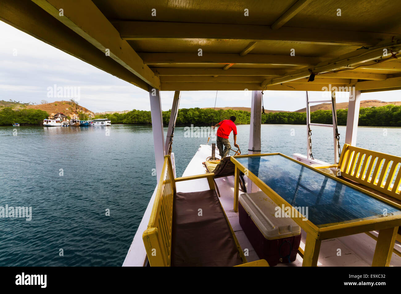 Boat approaching the dock in Kima Bay, Rinca Island, Komodo National ...