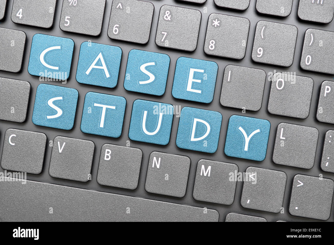 Blue case study key on keyboard Stock Photo - Alamy