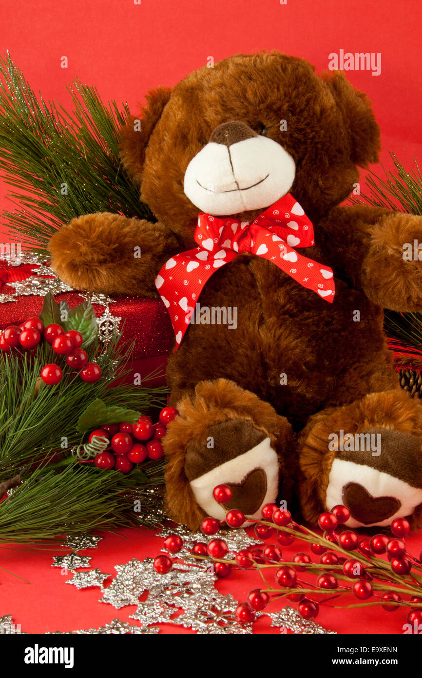 A holiday teddy bear with a Christmas present Stock Photo - Alamy