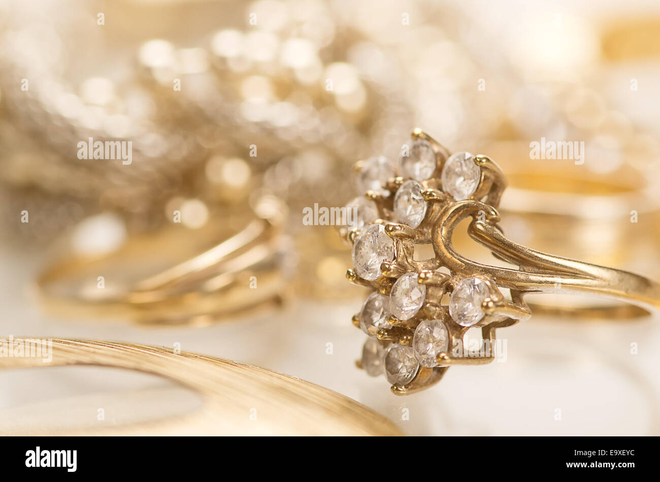 Gold jewelry with diamonds with reflection Stock Photo - Alamy