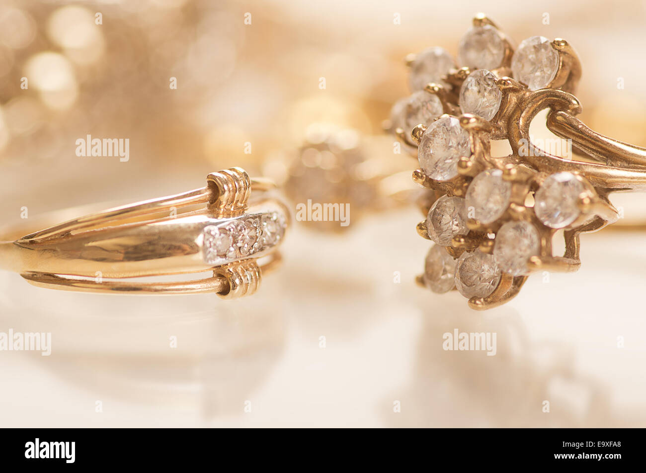 Gold jewelry with diamonds with reflection Stock Photo - Alamy