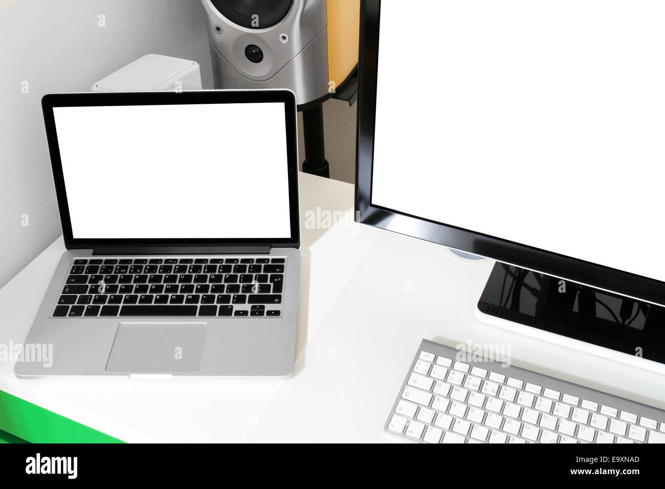 Laptop on the computer desk with monitor and keyboard Stock Photo - Alamy