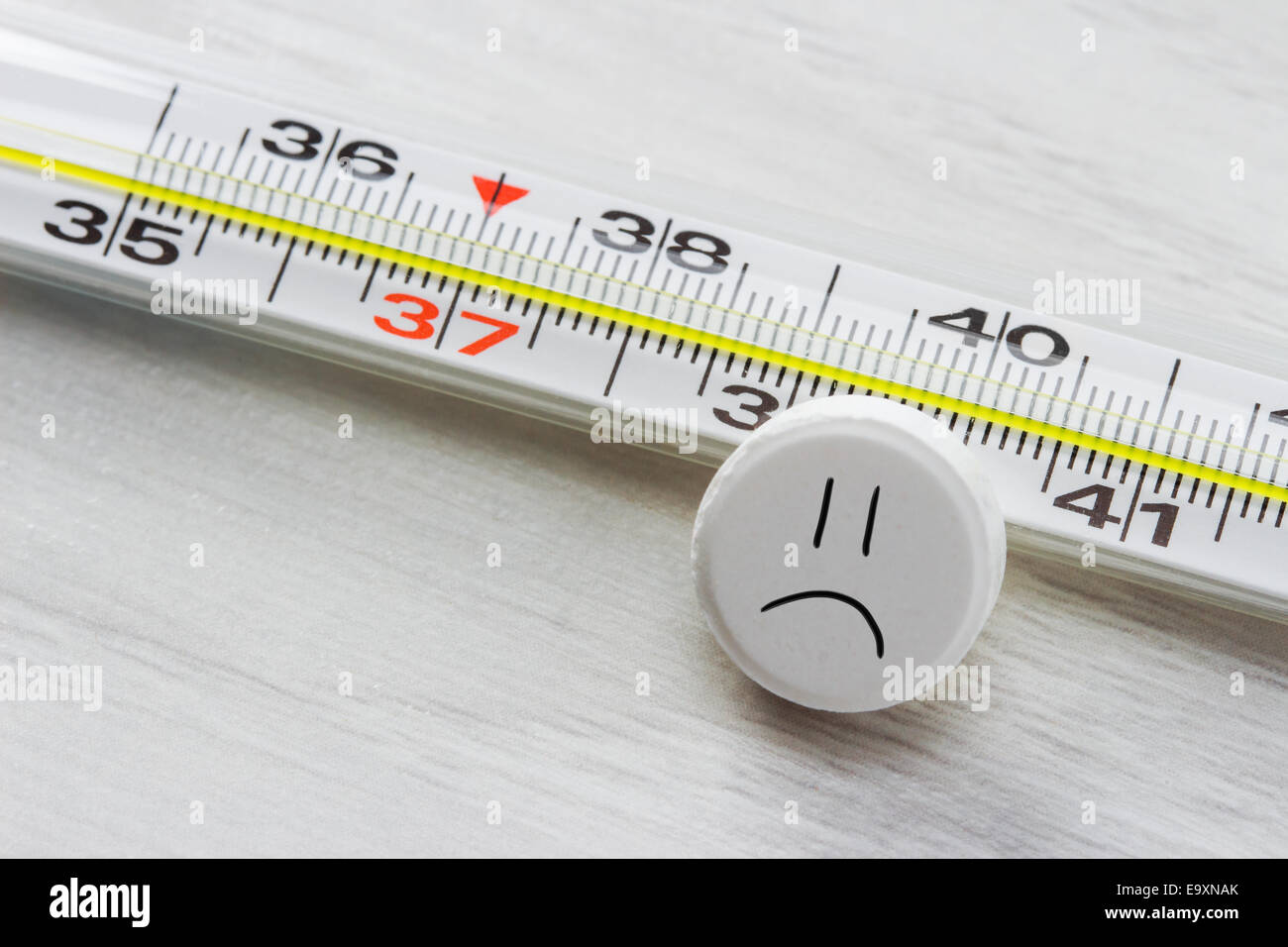 Thermometer to measure the temperature of the body with pills Stock ...