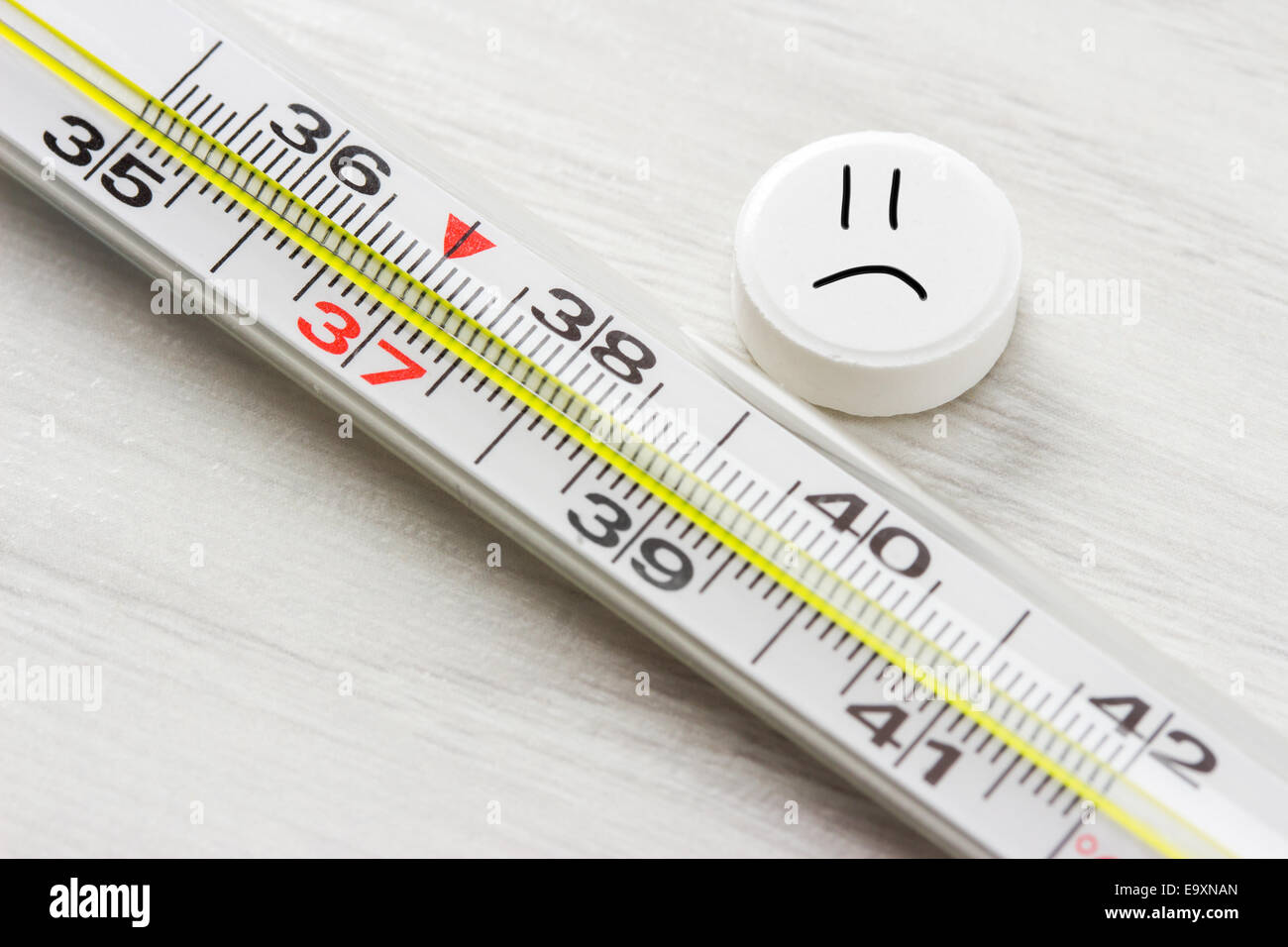 Thermometer to measure the temperature of the body with pills Stock ...