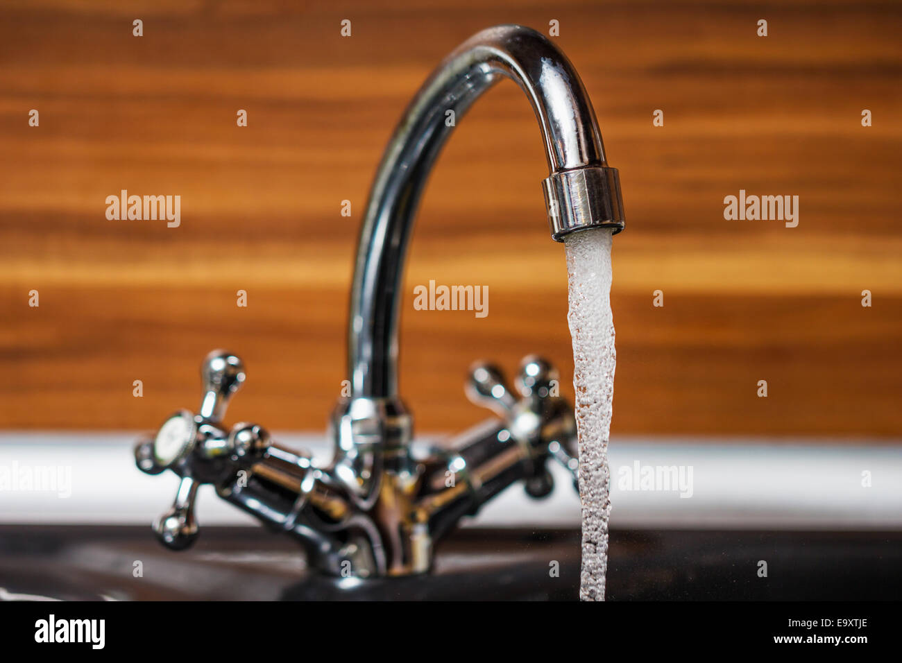 Kitchen Chrome sink with modern design Stock Photo - Alamy