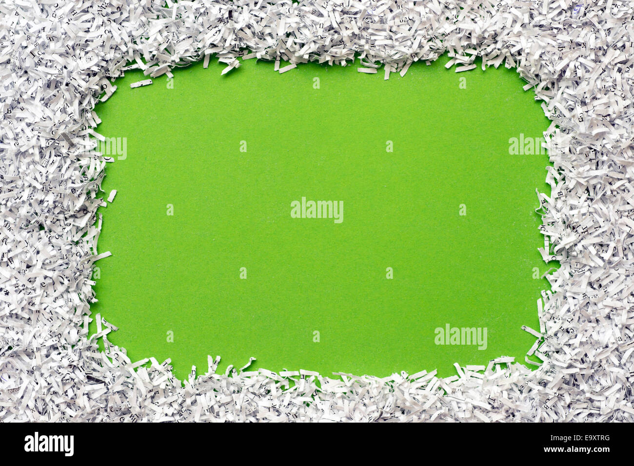 green background with shredded paper frame around Stock Photo - Alamy