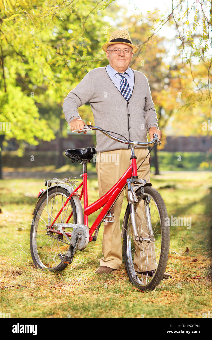 Male pushing a bike hi-res stock photography and images - Alamy
