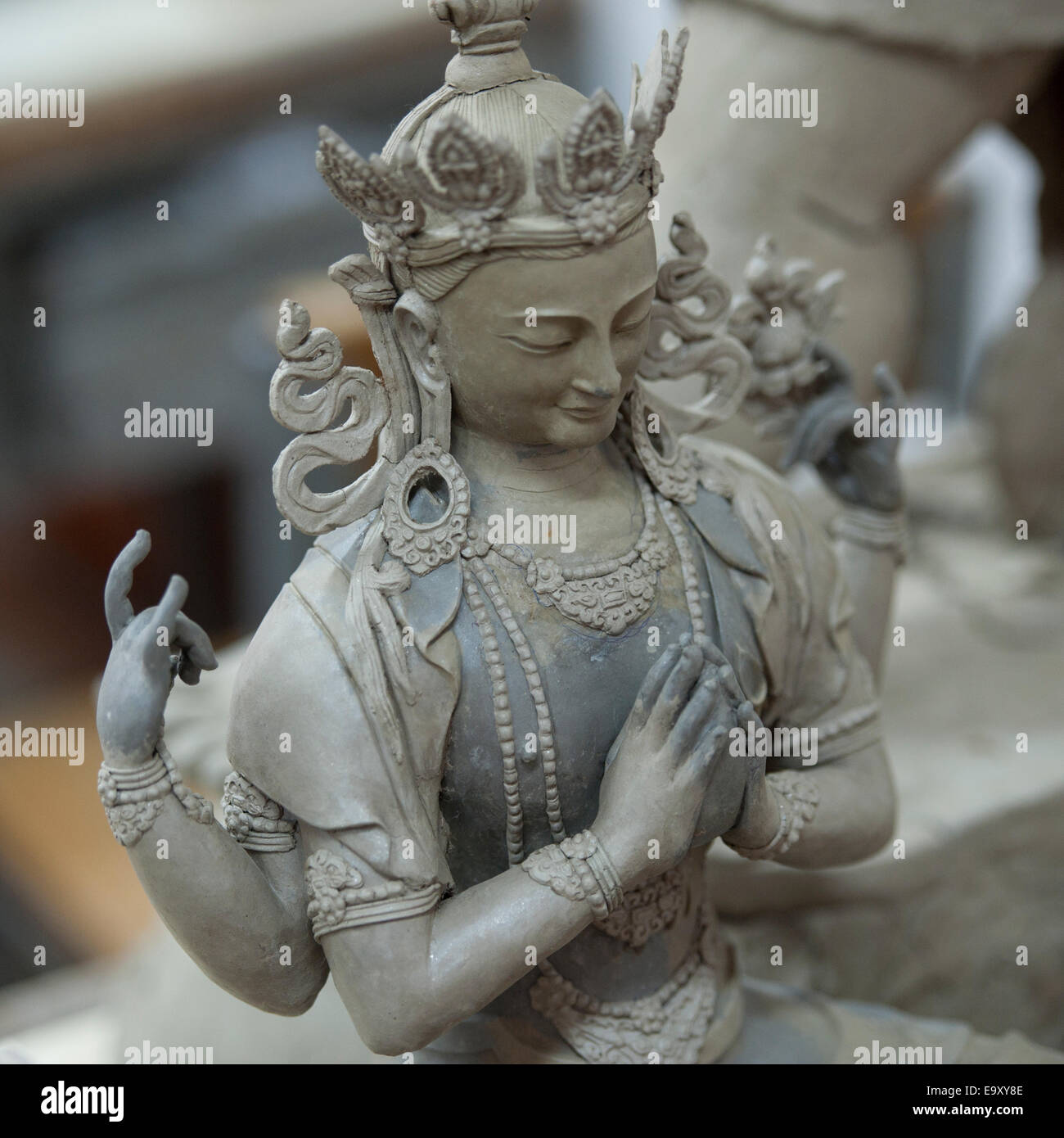 Statue with four arms at Thirteen Arts and Crafts School in Bhutan ...