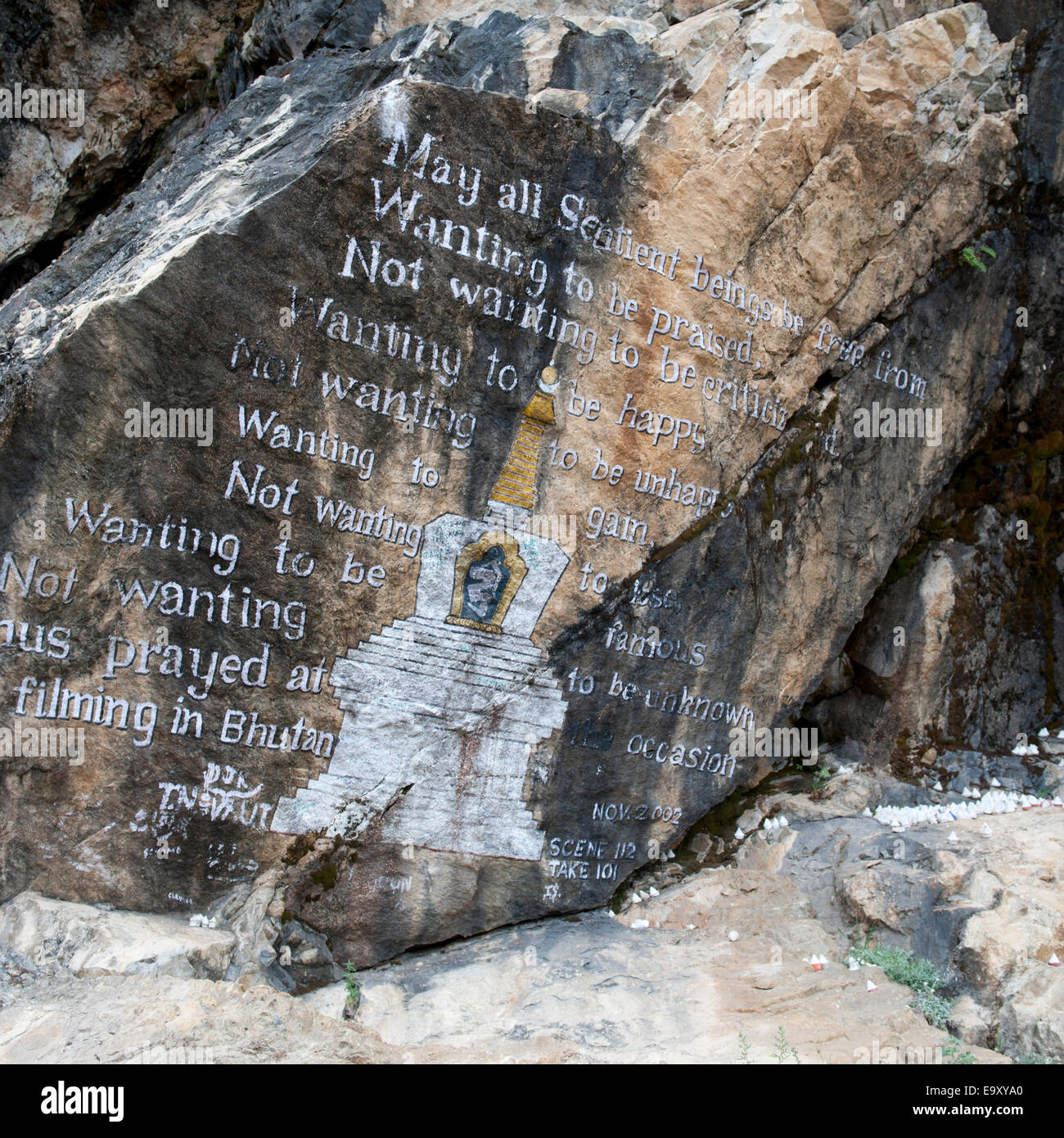 Script written on a rock in Bhutan Stock Photo - Alamy