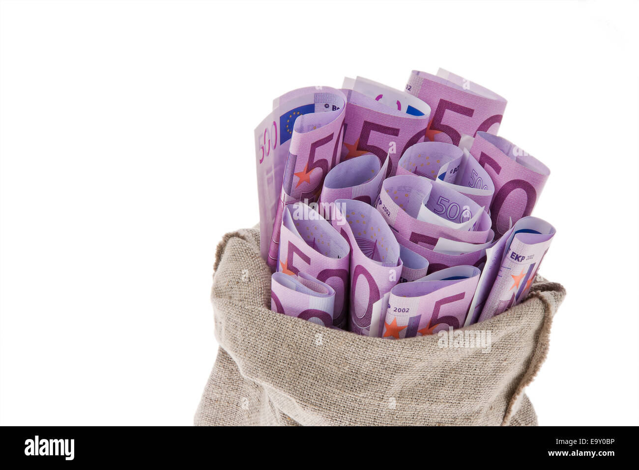 A bag with lots of euro bills. Wealth on a white background Stock Photo ...