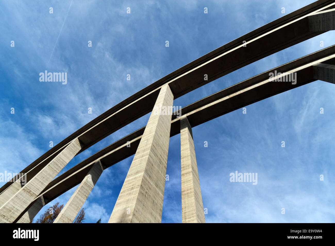 A high freeway bridge and concrete pillars seen from below Stock Photo ...