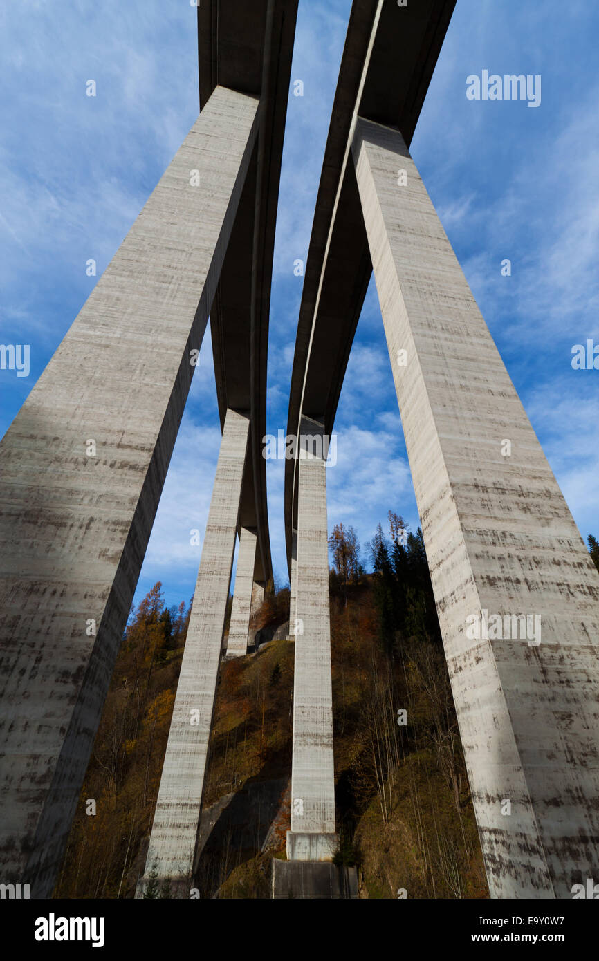A high freeway bridge and concrete pillars seen from below Stock Photo ...