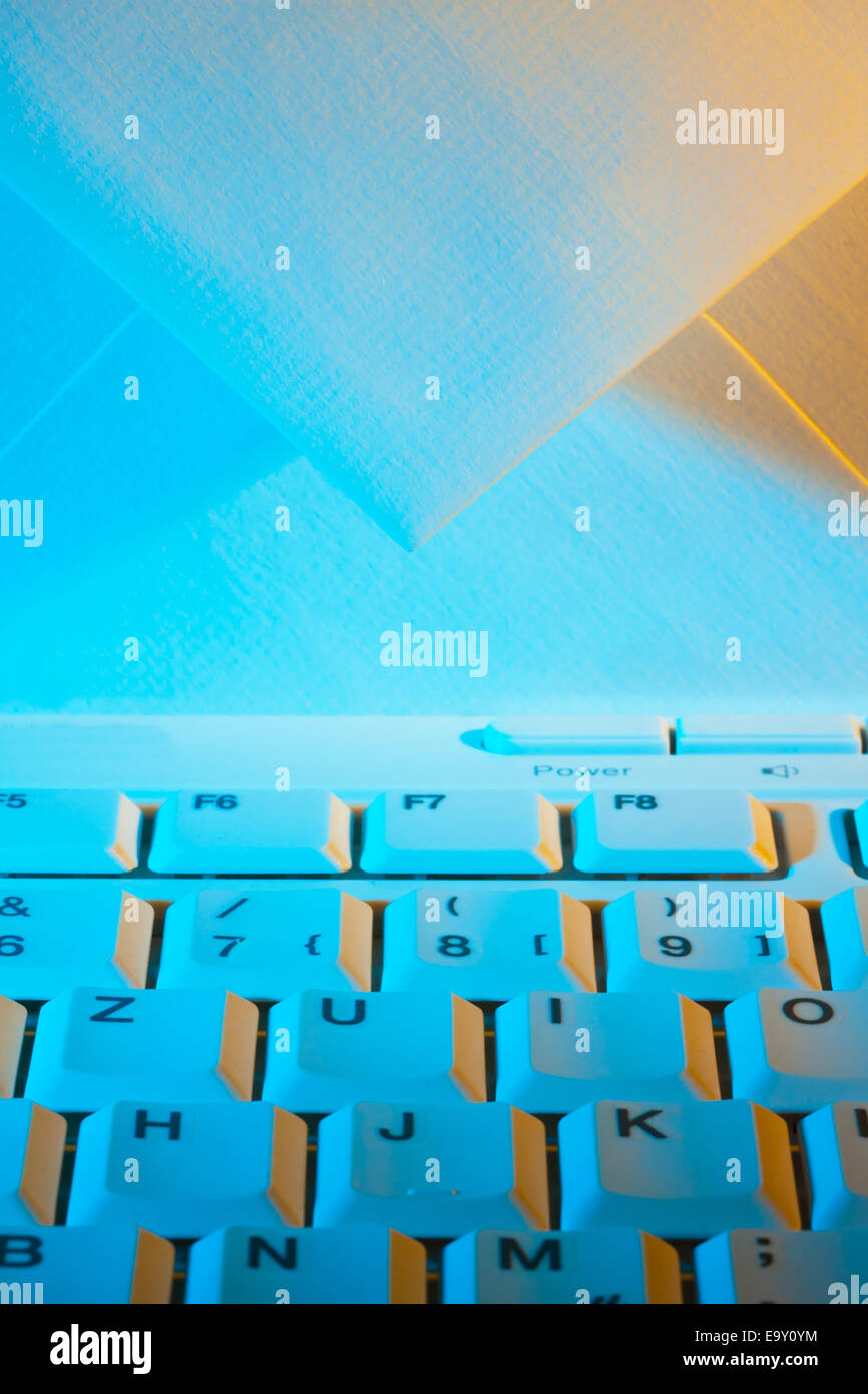 The keyboard of a computer and an envelope. Communication via e-mail ...