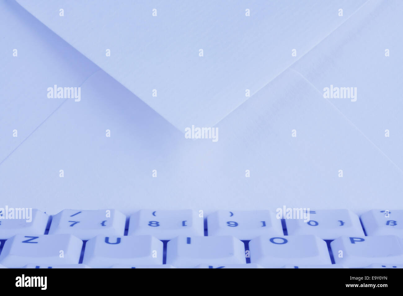 The keyboard of a computer and an envelope. Communication via e-mail ...