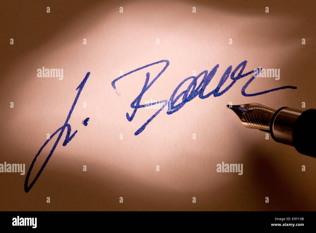 Handwritten signature with pen on a letter Stock Photo - Alamy