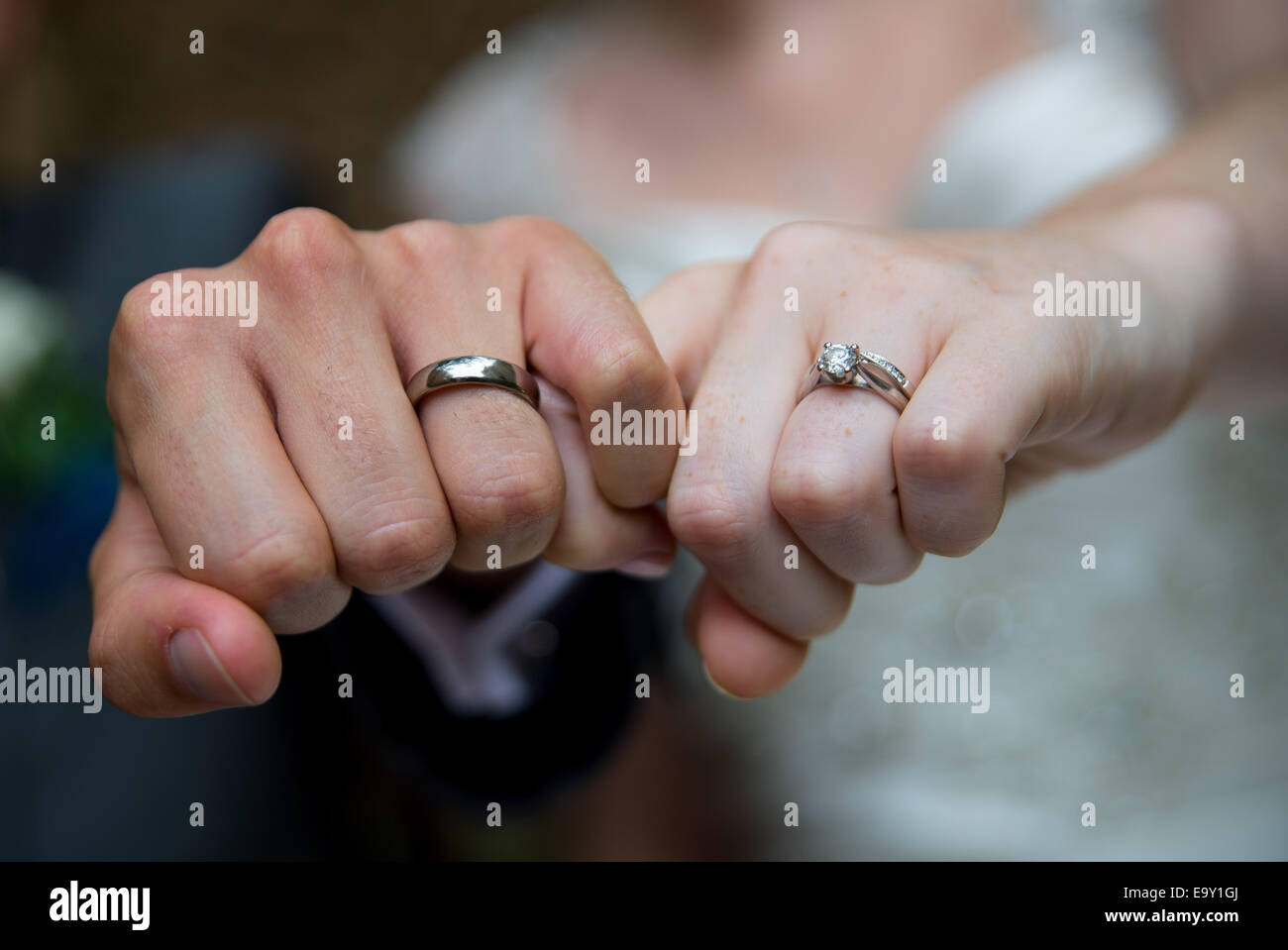 A newly married couple show off their wedding rings Stock Photo - Alamy