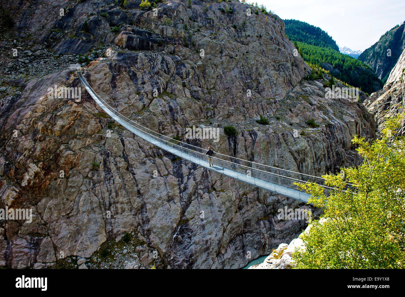 Stressed-ribbon bridge across Massa Gorge, Belalp tourism region ...