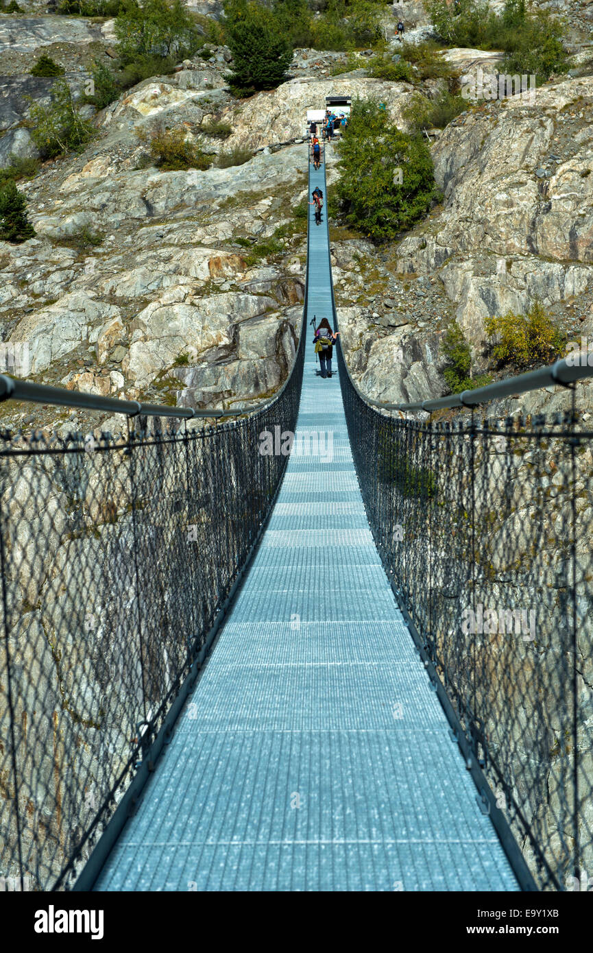 Stressed-ribbon bridge across Massa Gorge, Belalp tourism region ...