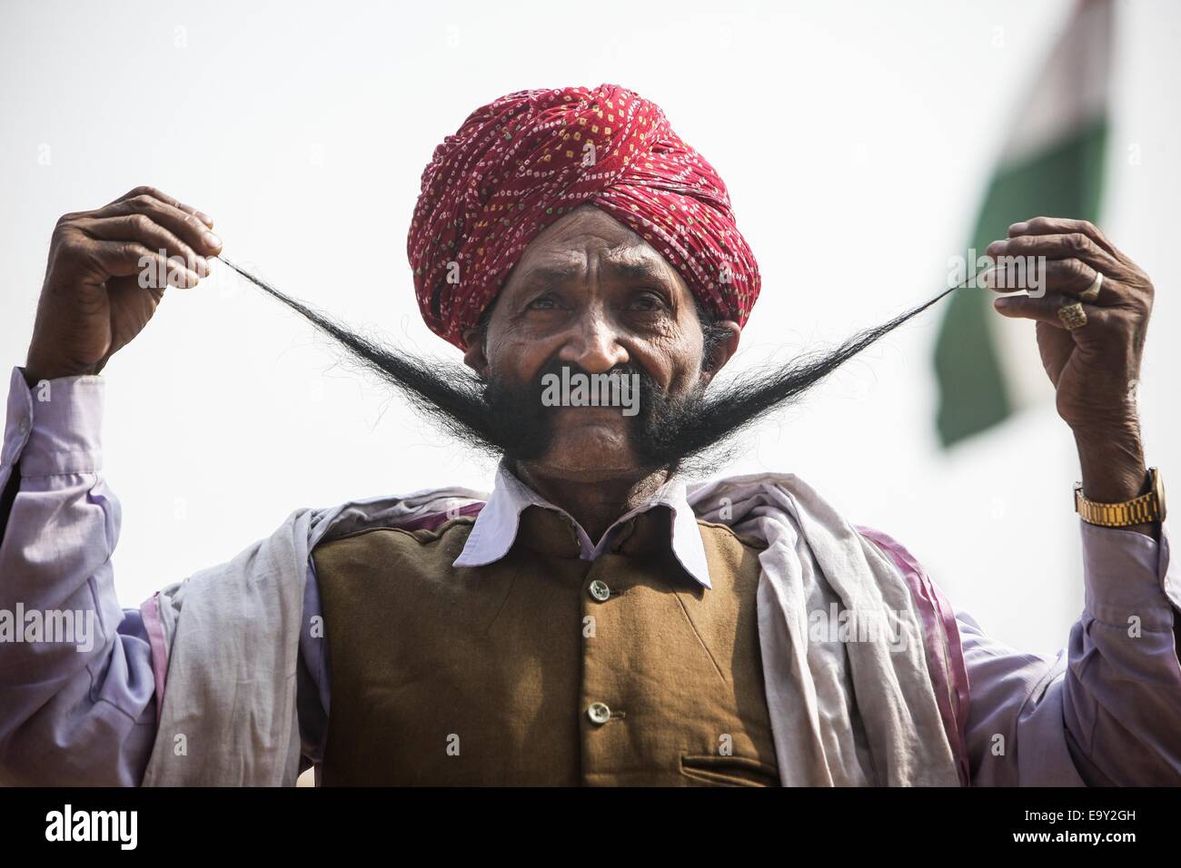 Rajasthan, India. 4th Nov, 2014. A participant shows his moustache at a ...