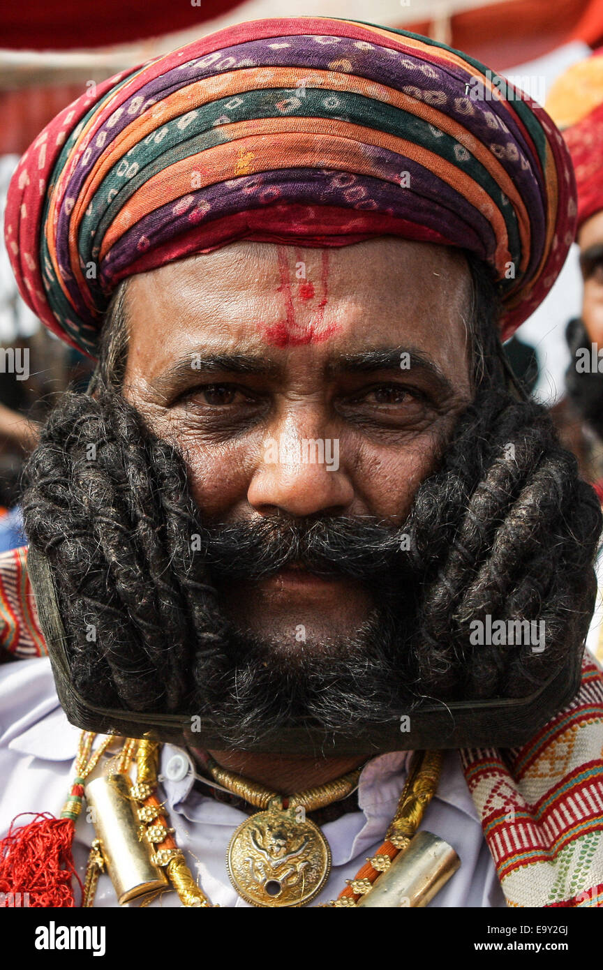 Rajasthan, India. 4th Nov, 2014. A participant shows his moustache at a ...