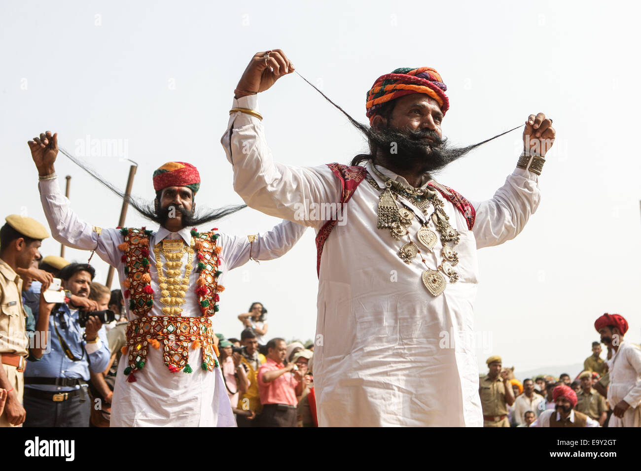 Rajasthan, India. 4th Nov, 2014. Participants show their moustaches at ...