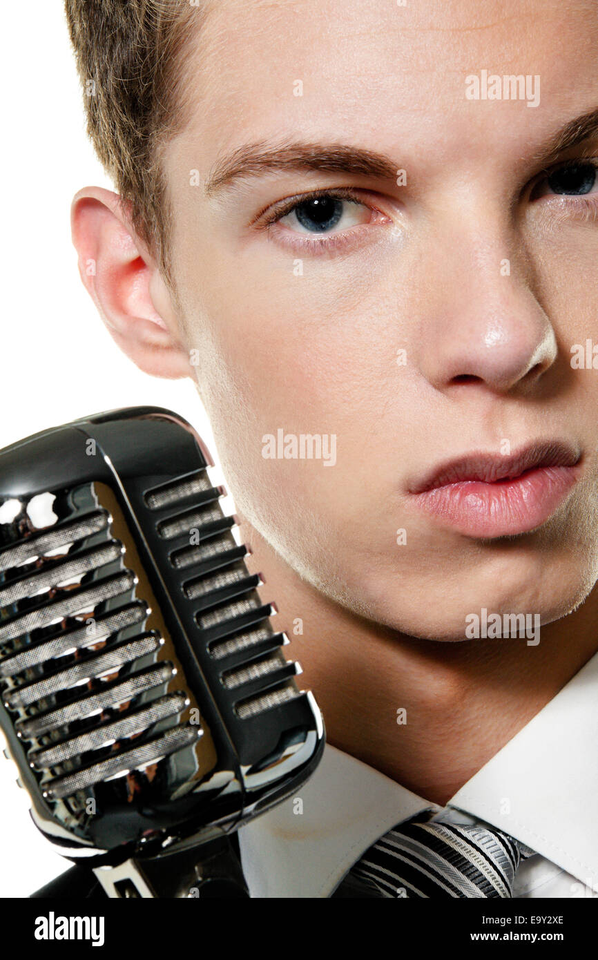 A young singer with retro microphone sings karaoke Stock Photo - Alamy