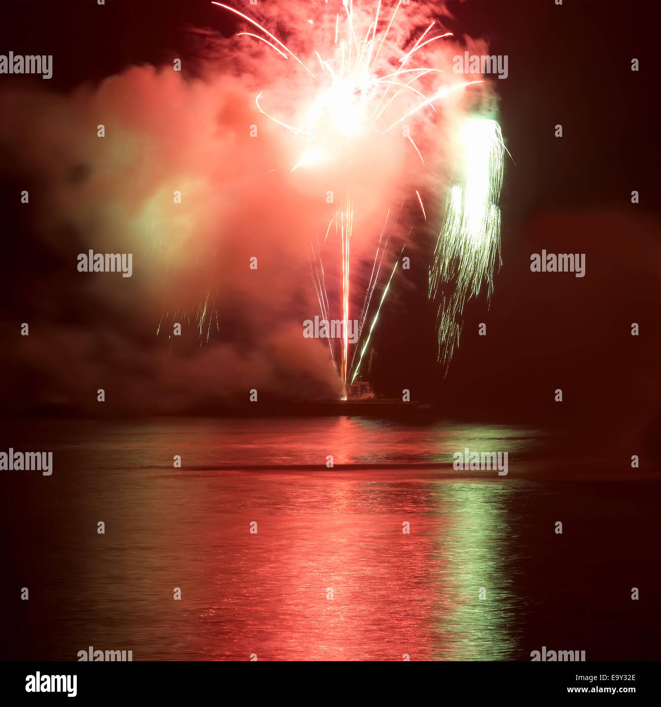 Red colorful fireworks on the black sky background. Holiday celebration ...