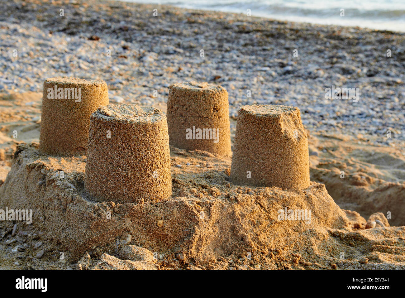 Towers from sand- castle on the beach Stock Photo - Alamy
