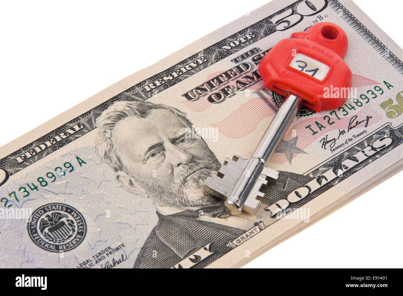 Dollar Currency notes and safe keys on a white background Stock Photo ...