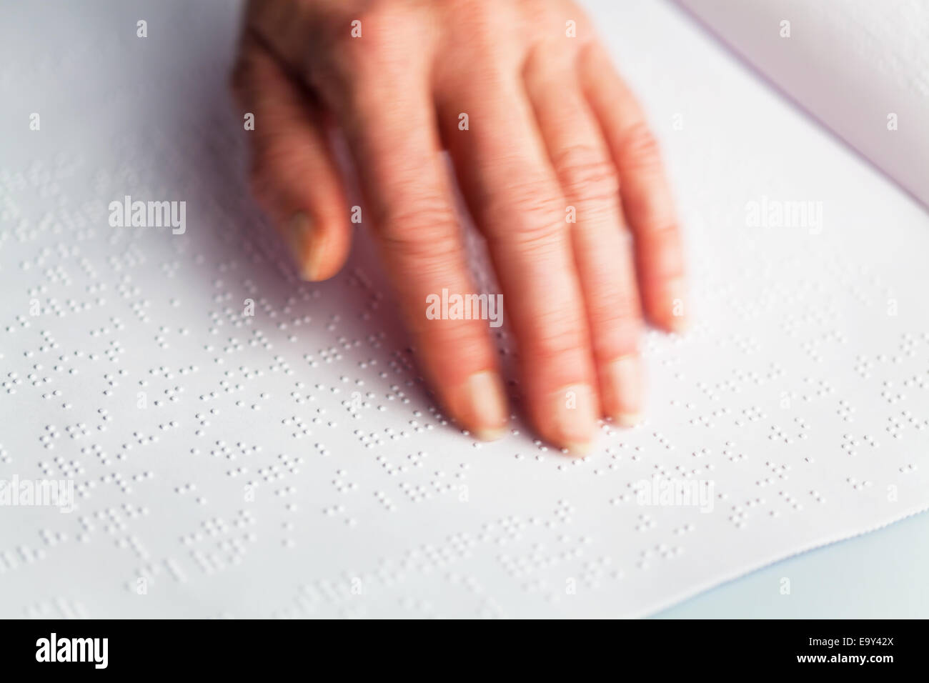 Fingers and Braille. Blind people read a book in Braille Stock Photo ...