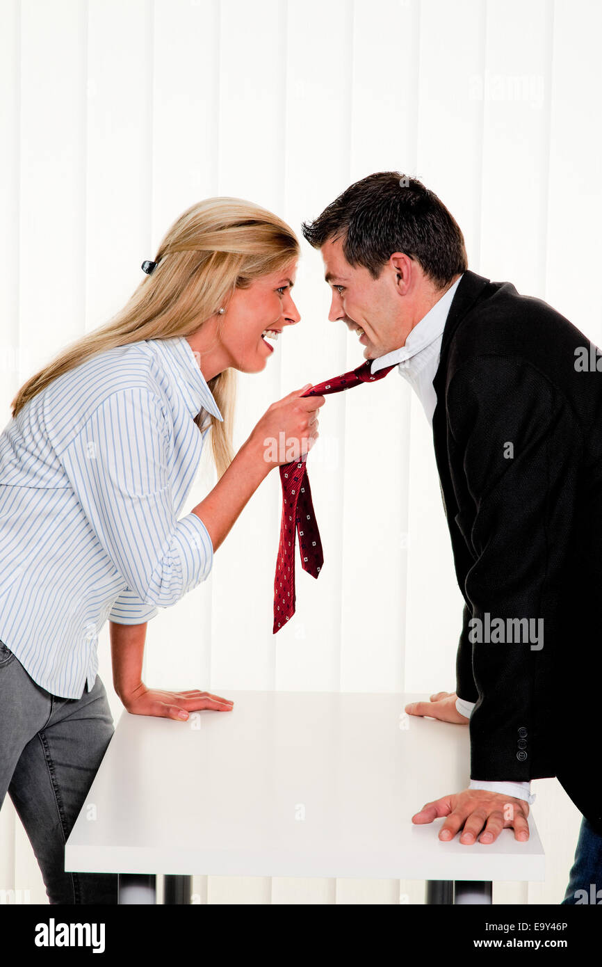 Dispute among employees at work in an office Stock Photo - Alamy