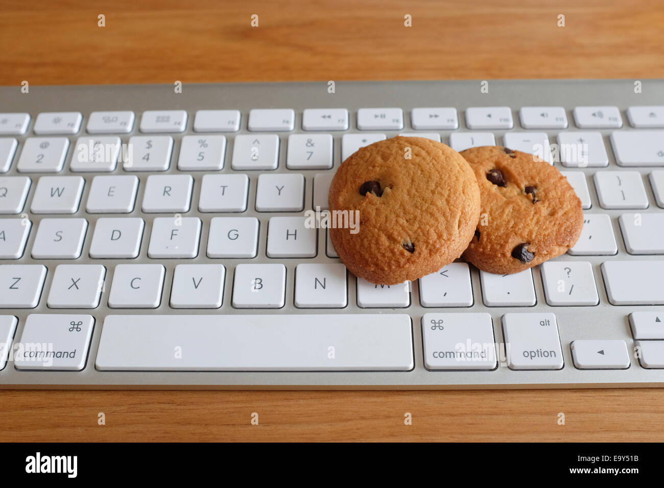Cookies on a computer keyboard Stock Photo - Alamy