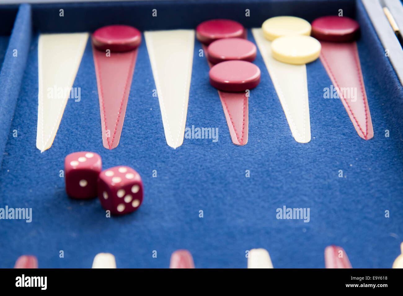 board games - red white and blue backgammon set in play Stock Photo - Alamy