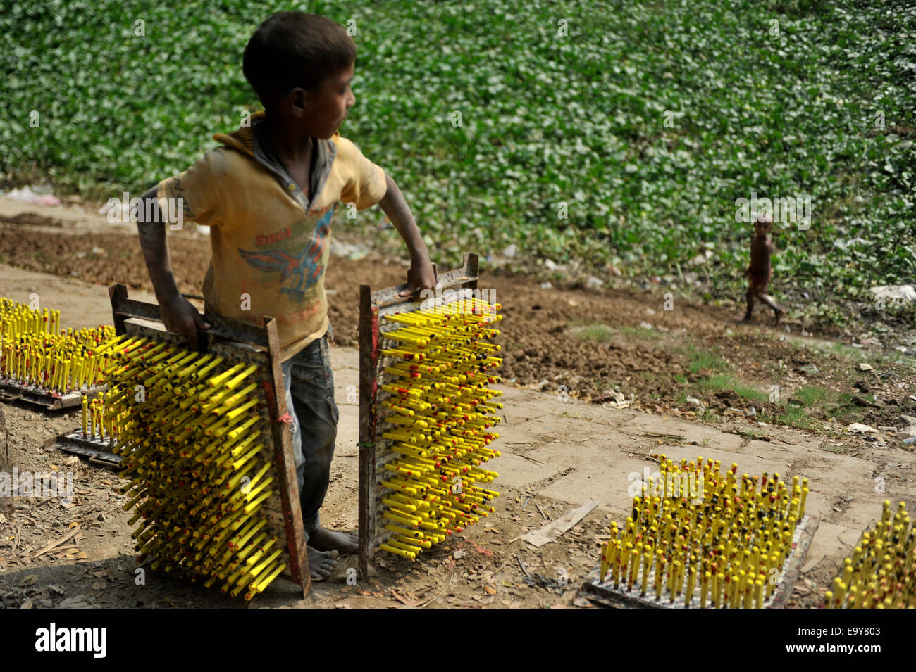 A Child works in a balloon factory's field at Dhaka. In Bangladesh ...