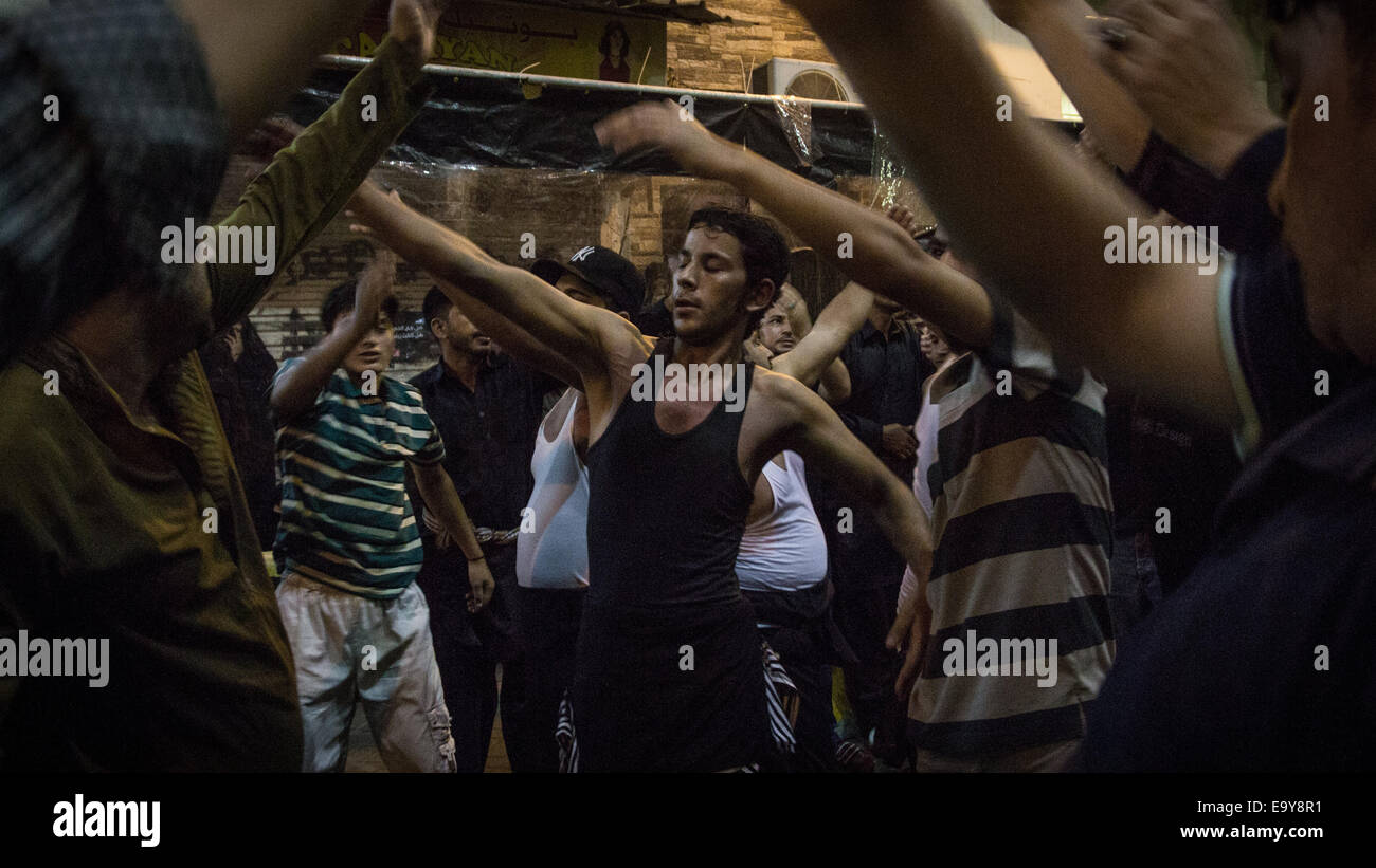 Bahrain. 04th Nov, 2014. Male Shia Muslims take part in ceremonial ...