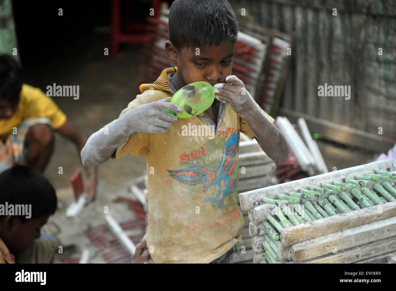 A Child works in a balloon factory's field at Dhaka. In Bangladesh ...