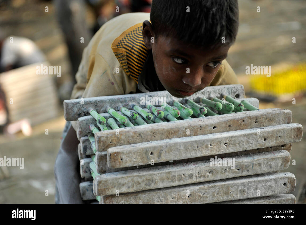 A Child works in a balloon factory's field at Dhaka. In Bangladesh ...
