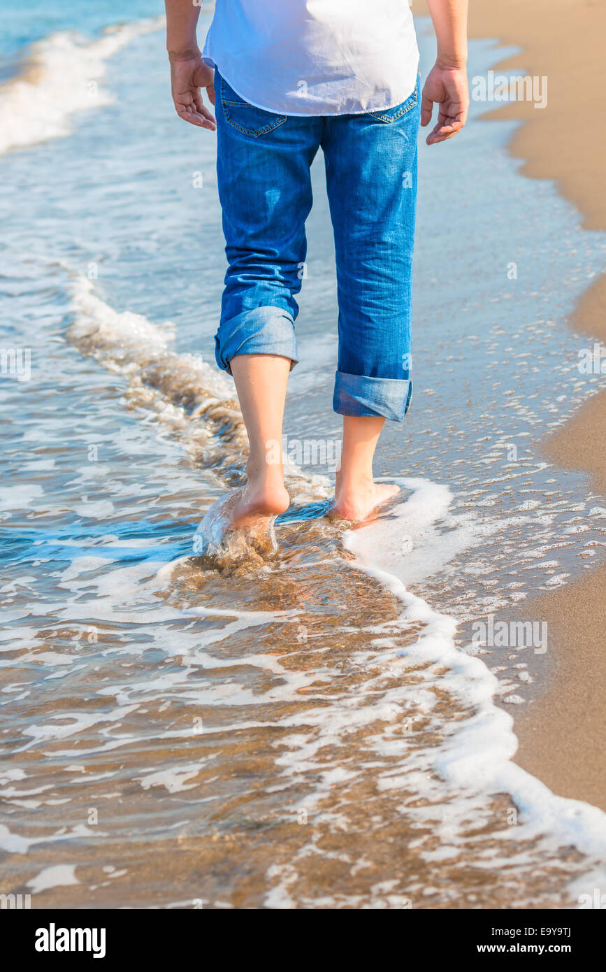 Barefoot man jeans hi-res stock photography and images - Alamy