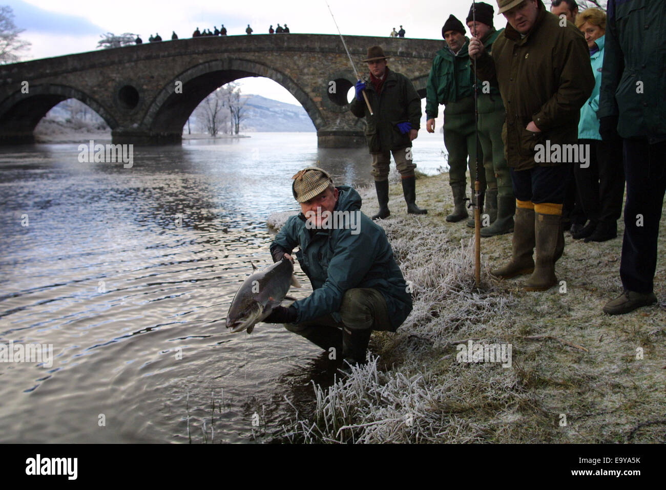 An angler releasing back into the water the first fish caught on the ...