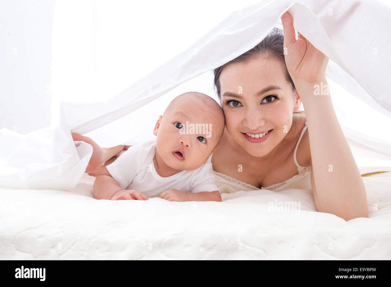 Baby and mother Stock Photo - Alamy