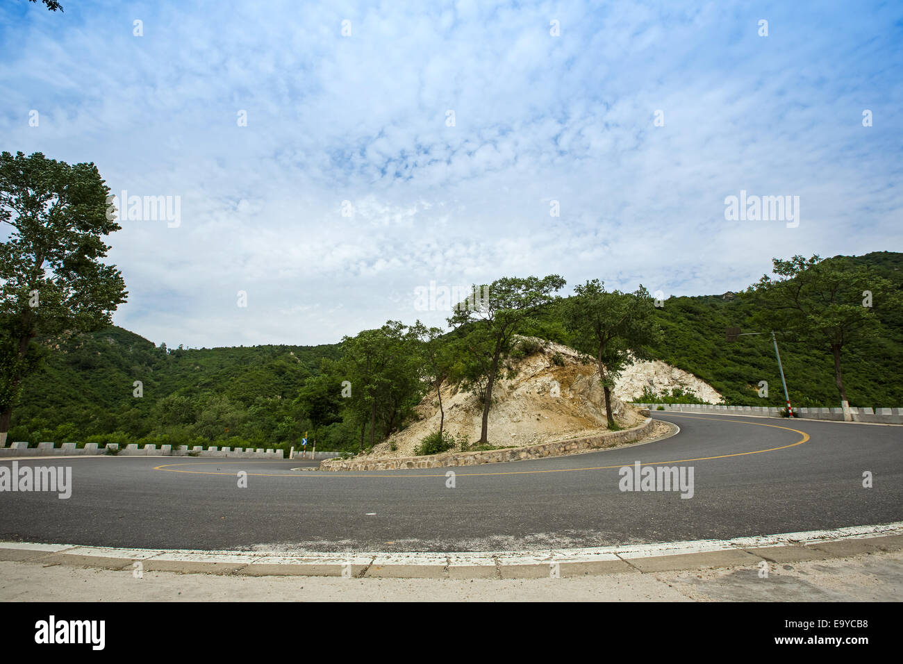 Curved mountain road Stock Photo - Alamy