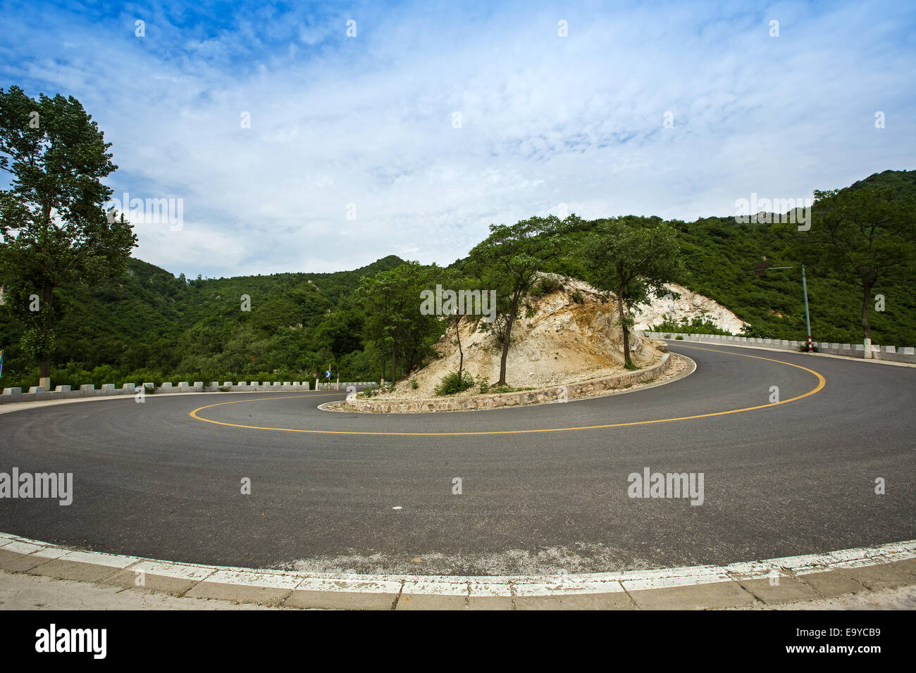 Curved mountain road Stock Photo - Alamy
