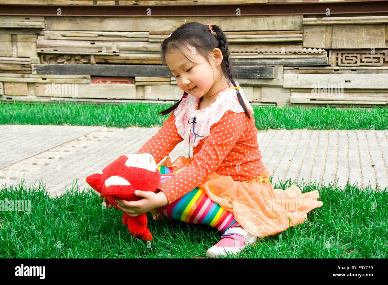 Cute girl at play Stock Photo - Alamy