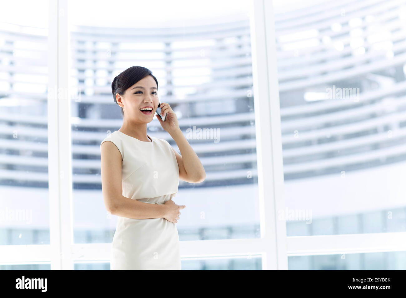 Young woman using phone Stock Photo - Alamy