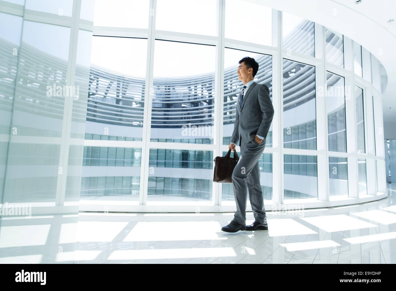 Office worker walking building hi-res stock photography and images - Alamy