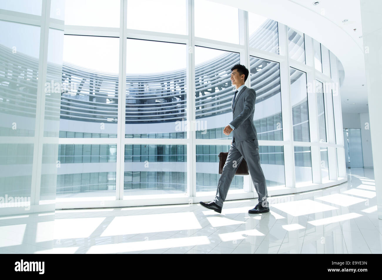 Office worker walking building hi-res stock photography and images - Alamy