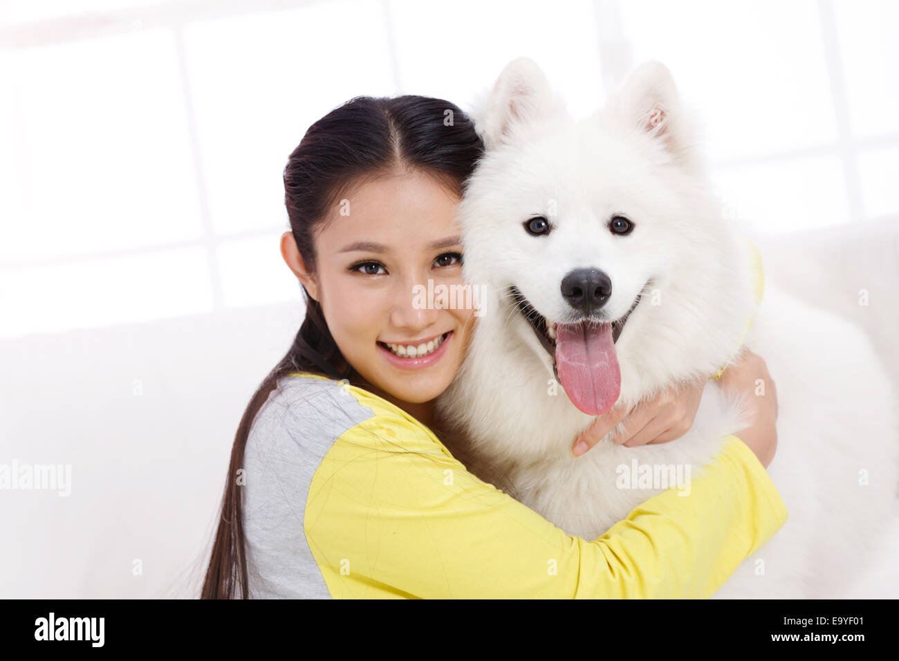 Young woman with dog Stock Photo - Alamy