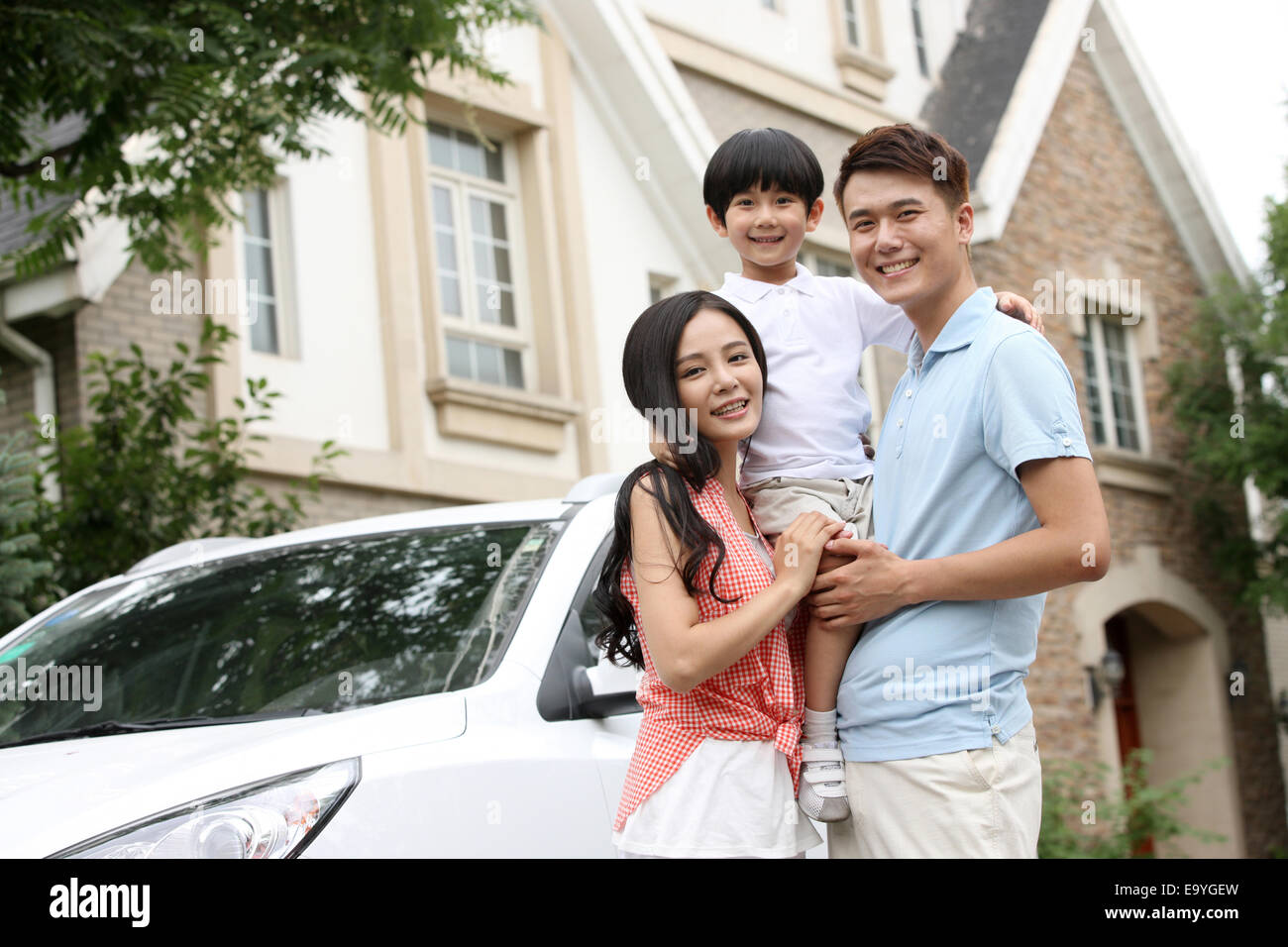 Boy with his parents Stock Photo - Alamy